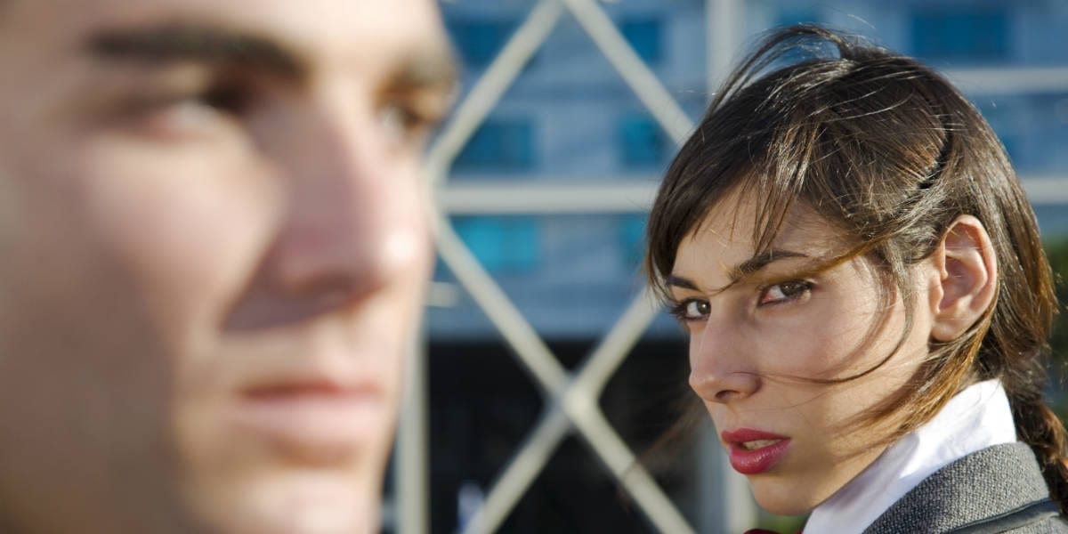 woman looking at man envy jealousy - Crossroads Initiative