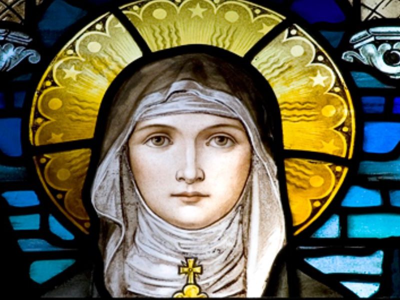 Clare of Assisi stained glass window public domain - Crossroads Initiative
