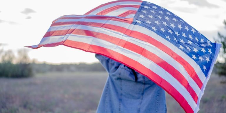 American flag, denim, waving flag 1200x600 - Crossroads Initiative